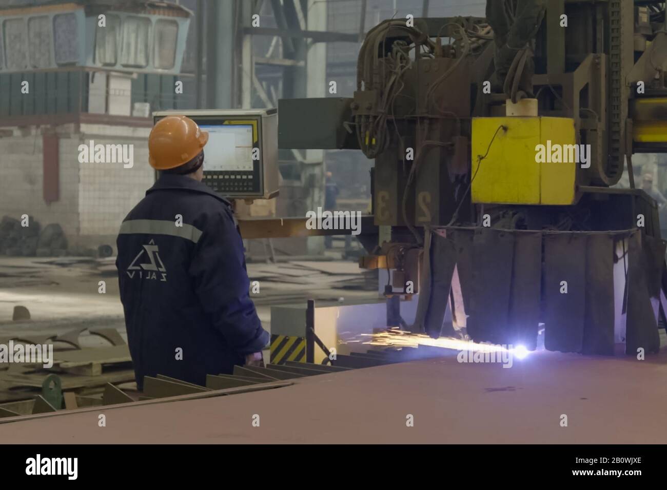 Novorossiysk, Russia - May 26, 2018: The worker welds the details with ...