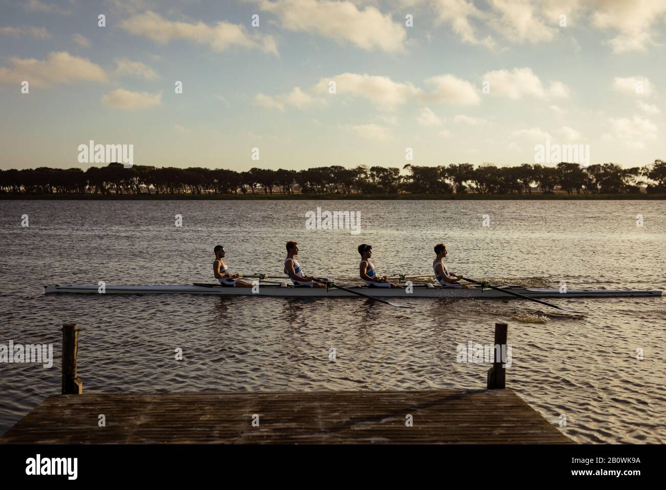 Colleagues rowing boat hi-res stock photography and images - Alamy