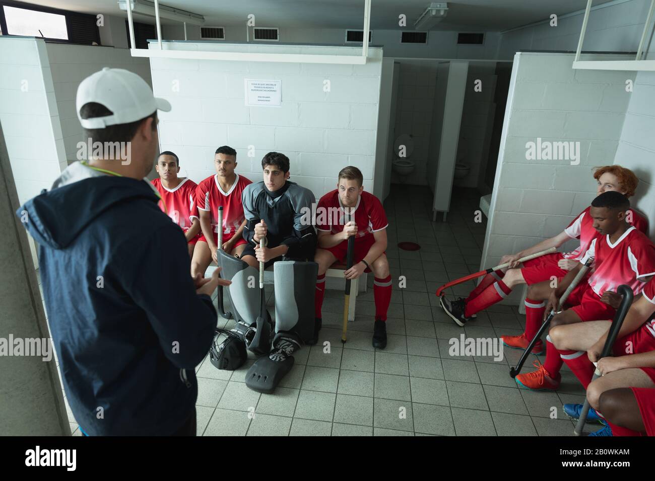 Hockey players sitting in the changing room Stock Photo - Alamy
