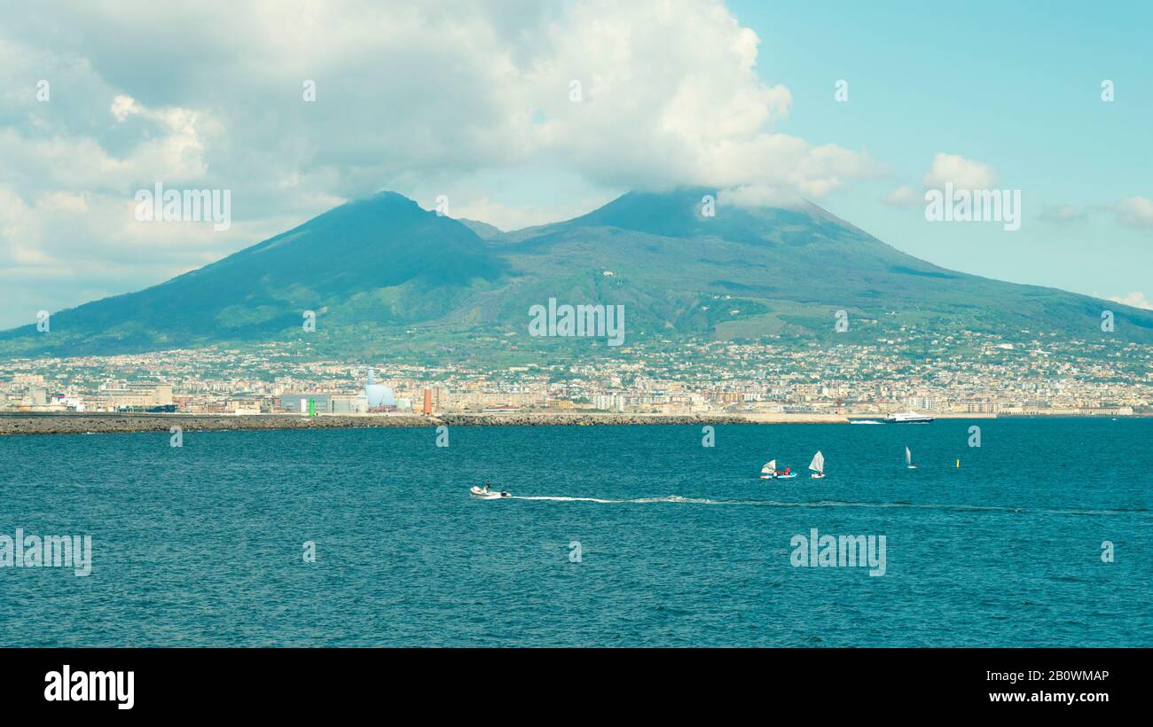 Naples view on volcano Vesuvius from offshore Napoli with wind surfers ...