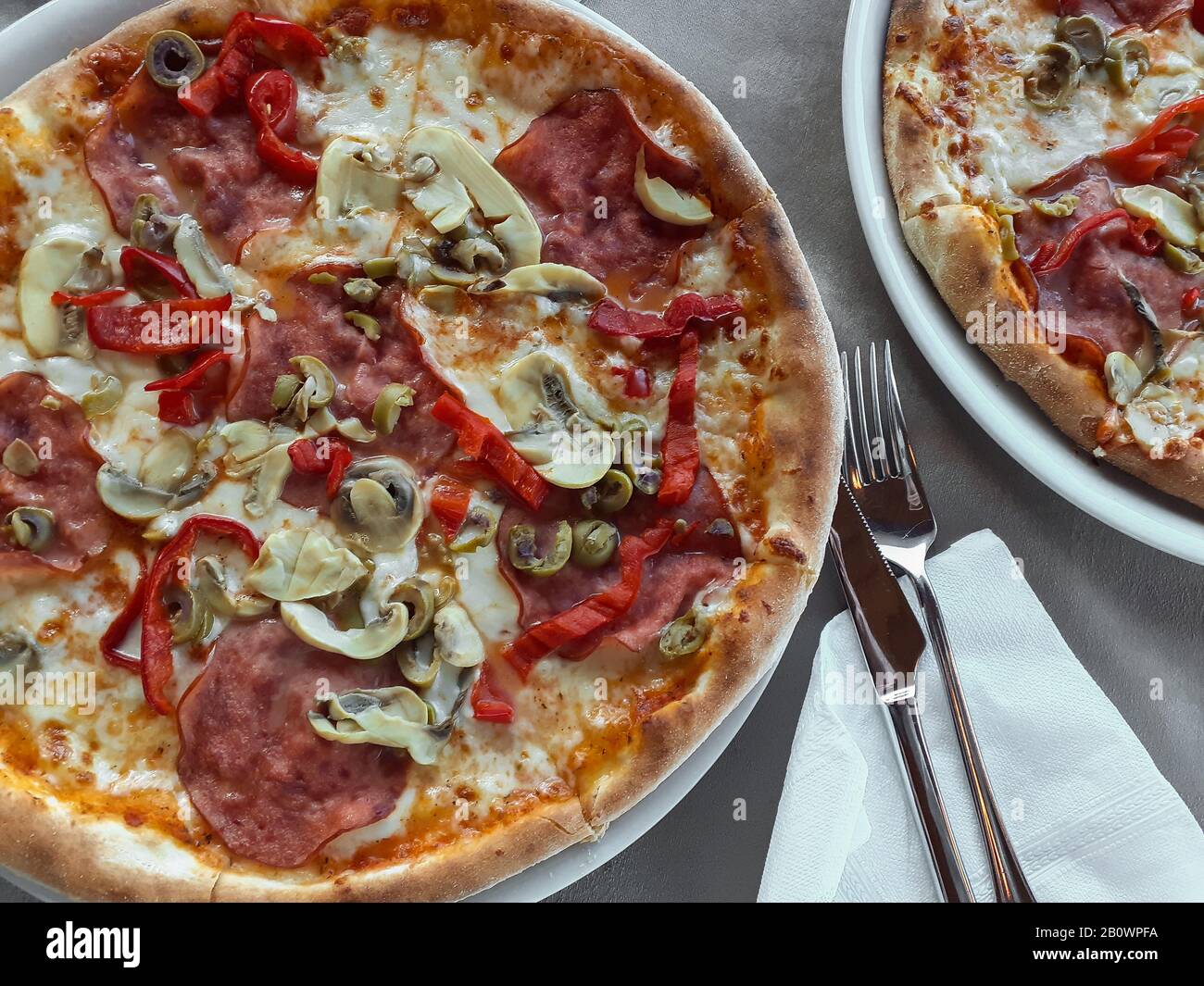 Ready to eat crusty pizza, junk food Stock Photo - Alamy