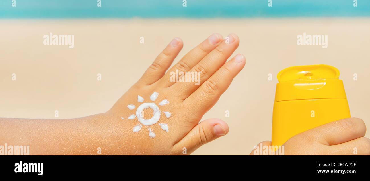 Sunscreen on the skin of a child. Selective focus. nature Stock Photo ...