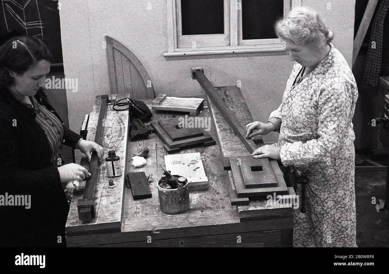 1940s, historical, night school, two mature ladies in a woodworking ...