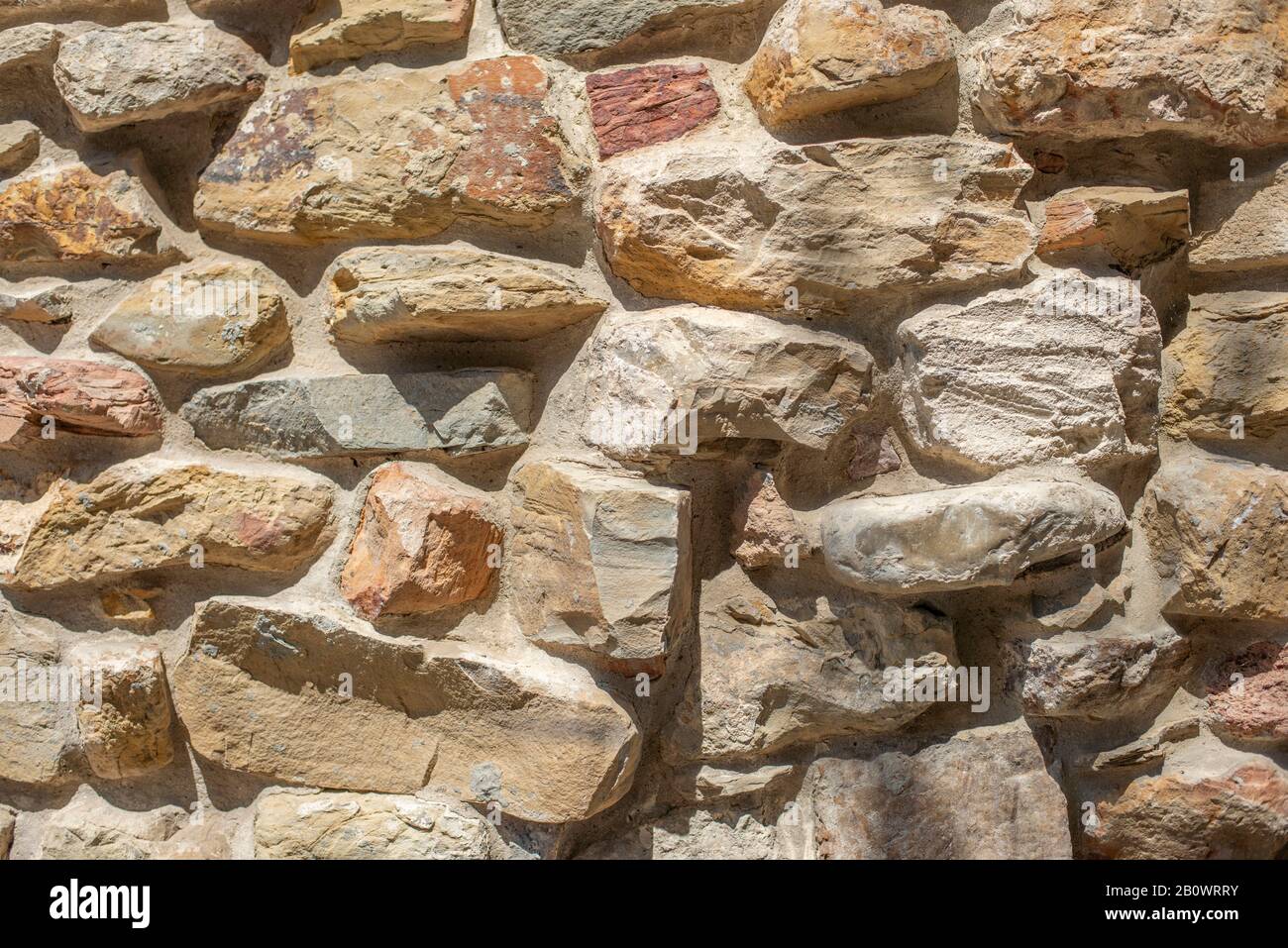 Laying of wild stone, texture of wild stone wall Stock Photo - Alamy