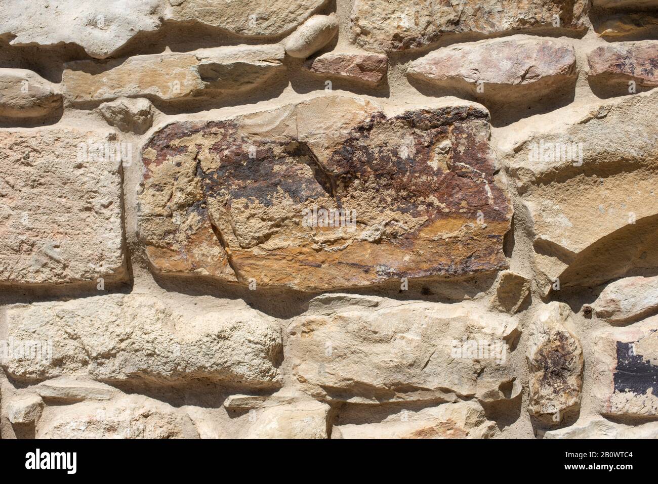 Laying of wild stone, texture of wild stone wall Stock Photo - Alamy