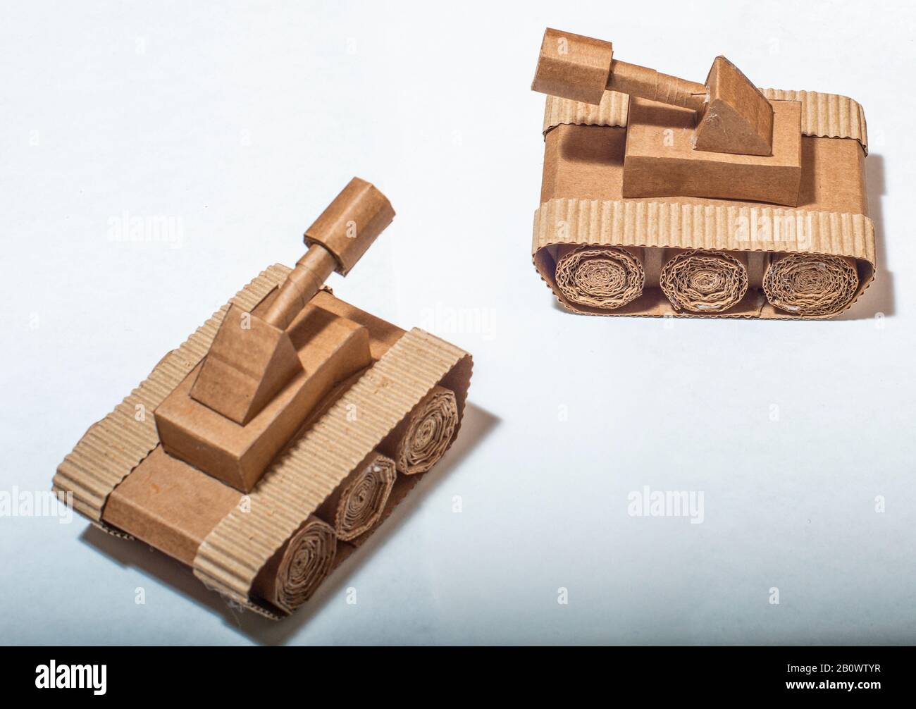 two toy tanks made by children from corrugated cardboard. toy cardboard ...