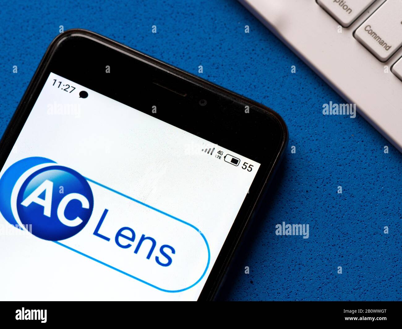 In this photo illustration an AC Lens logo seen displayed on a ...