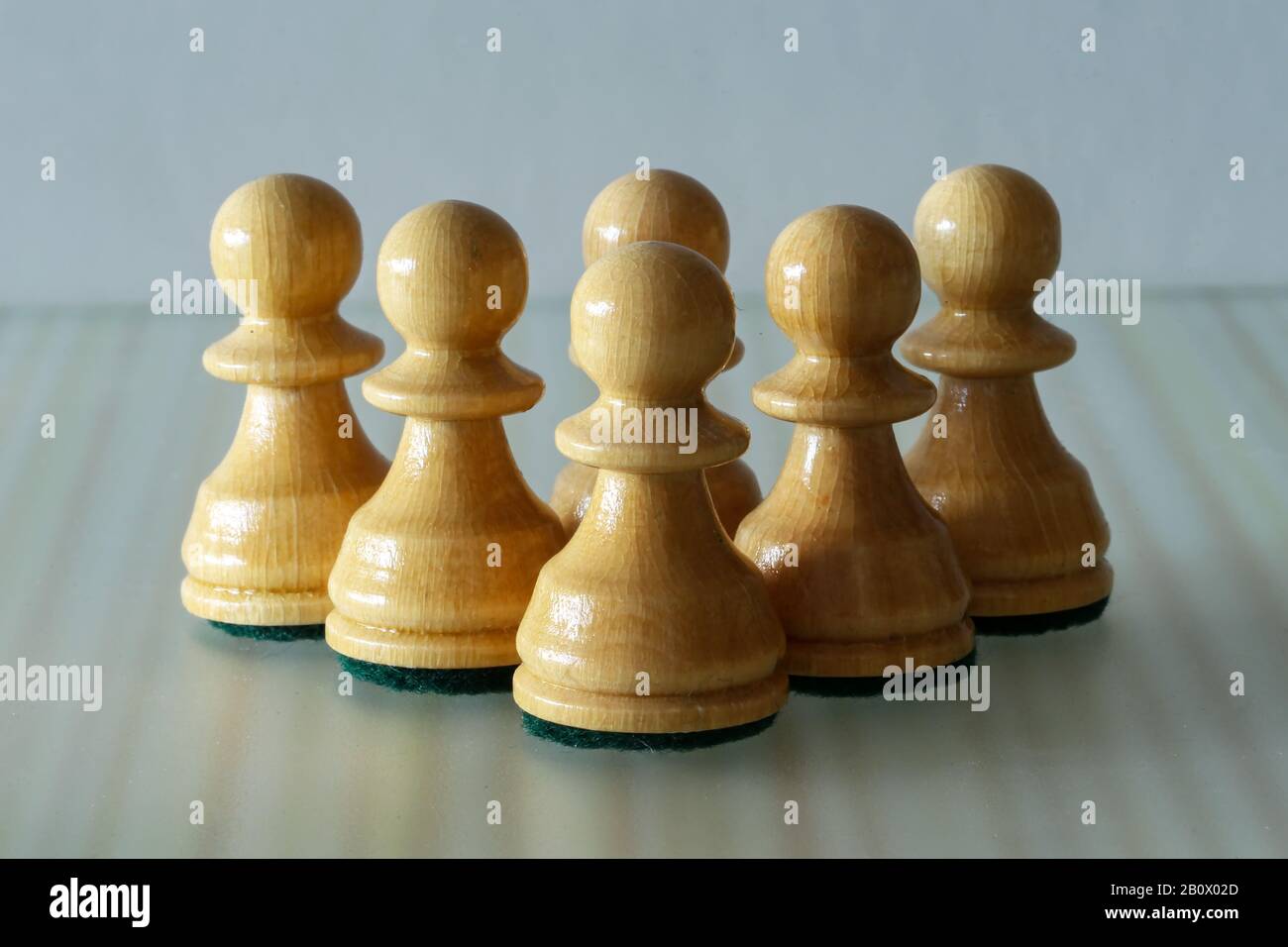 Pawn - chess pieces on a blurry light background Stock Photo - Alamy