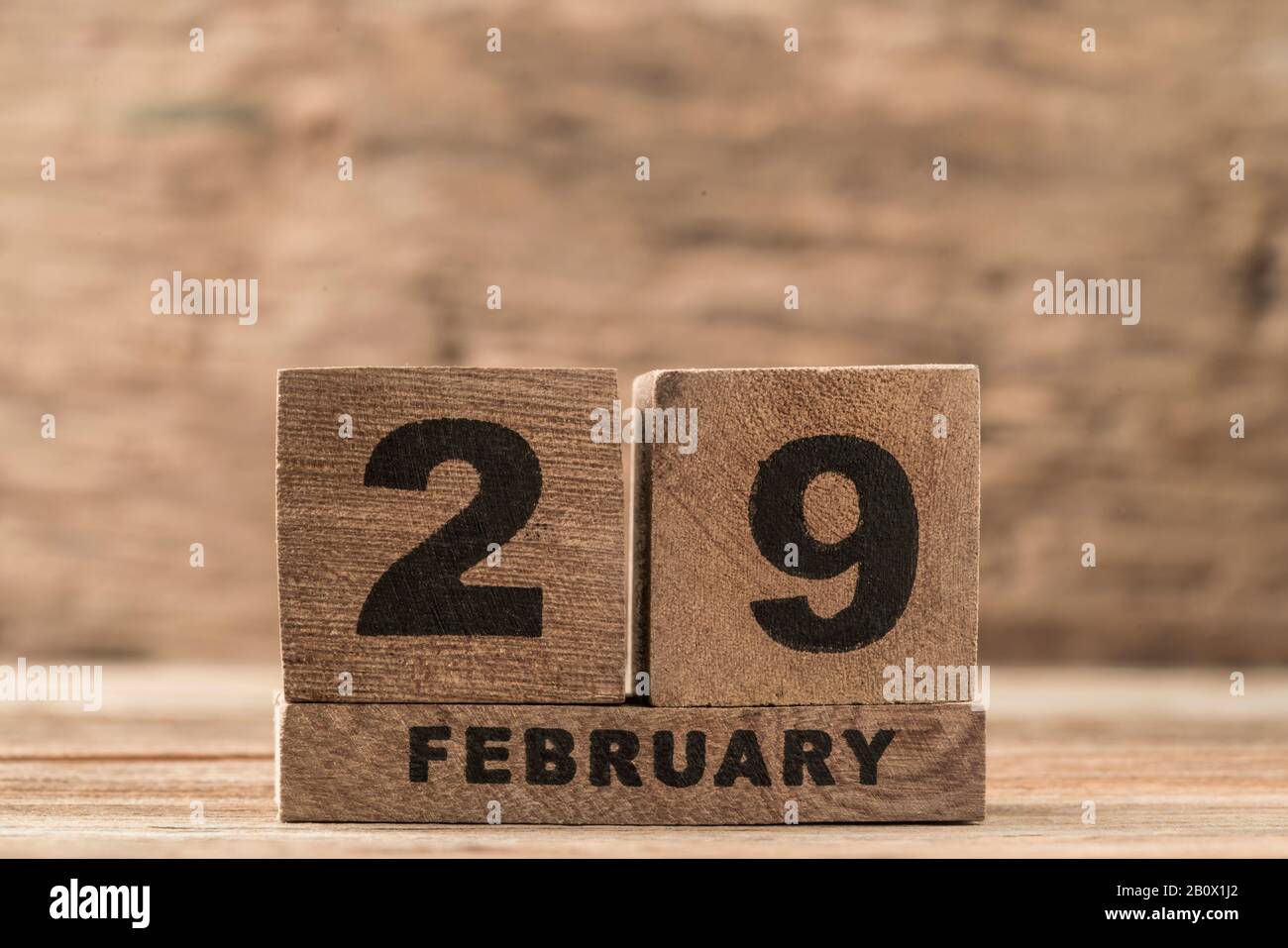 closeup cube calendar for february on wooden background with copy space ...