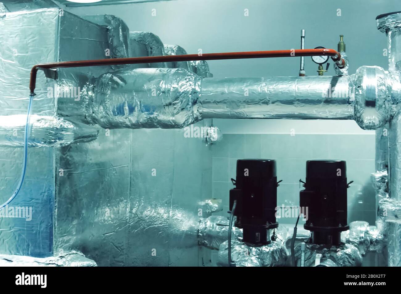 Thermal insulation of a pipes with foil Stock Photo - Alamy