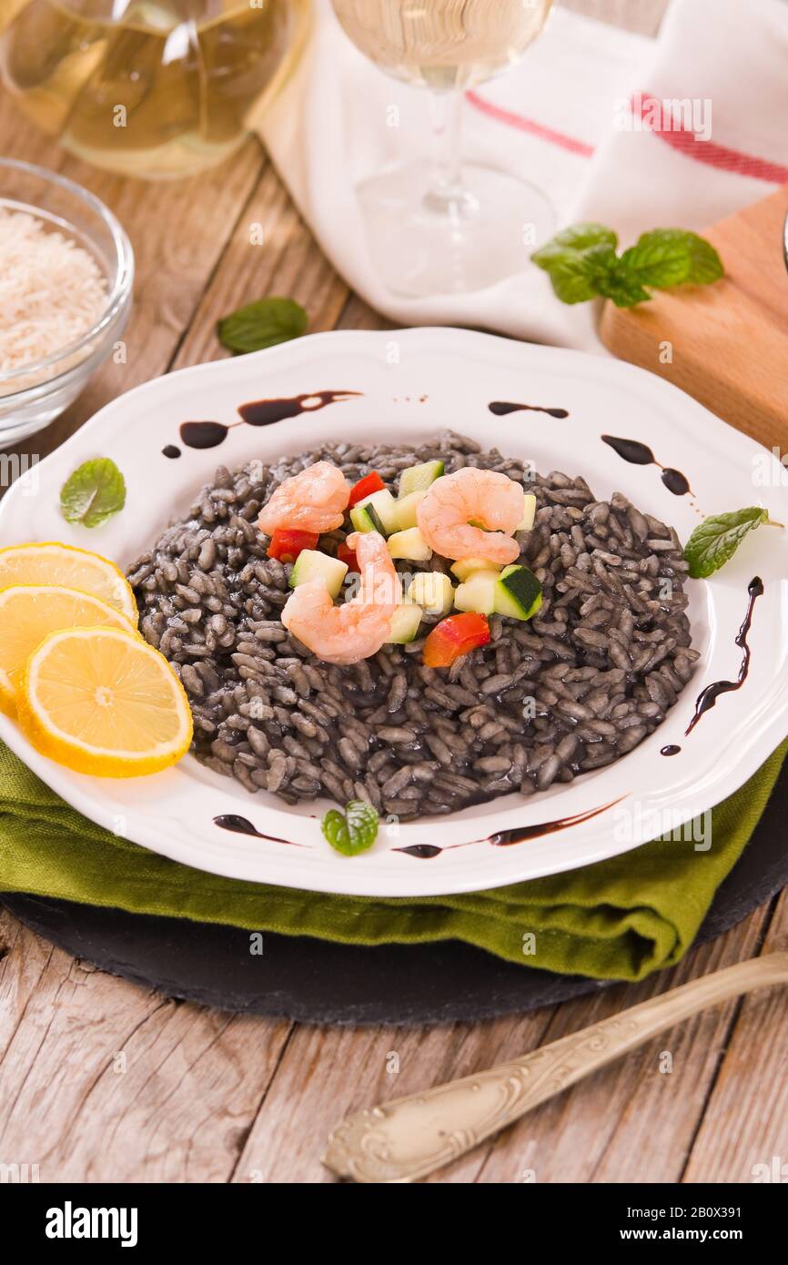 Squid ink risotto Stock Photo - Alamy