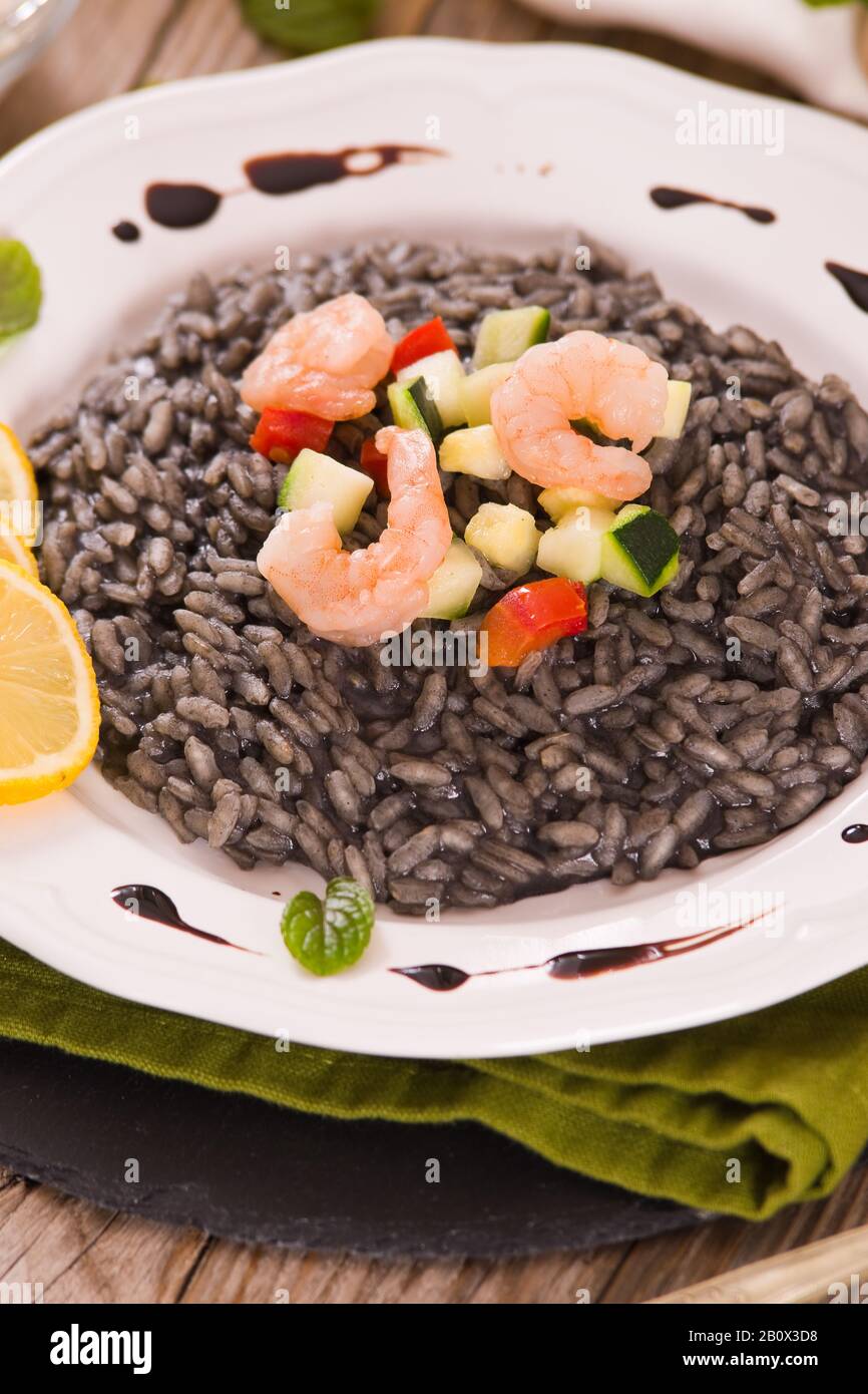 Squid ink risotto Stock Photo - Alamy