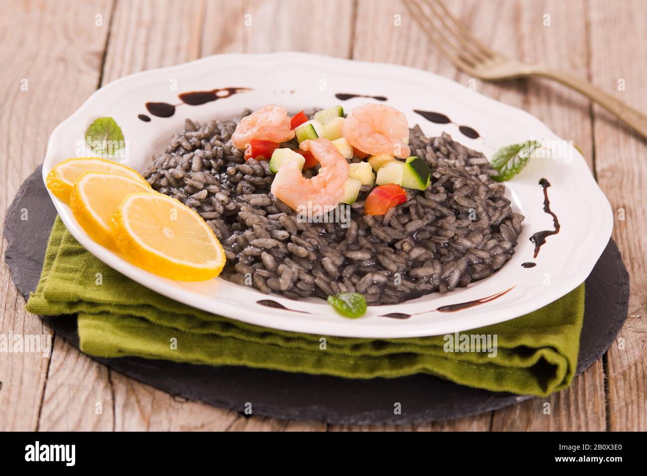 Squid ink risotto Stock Photo - Alamy