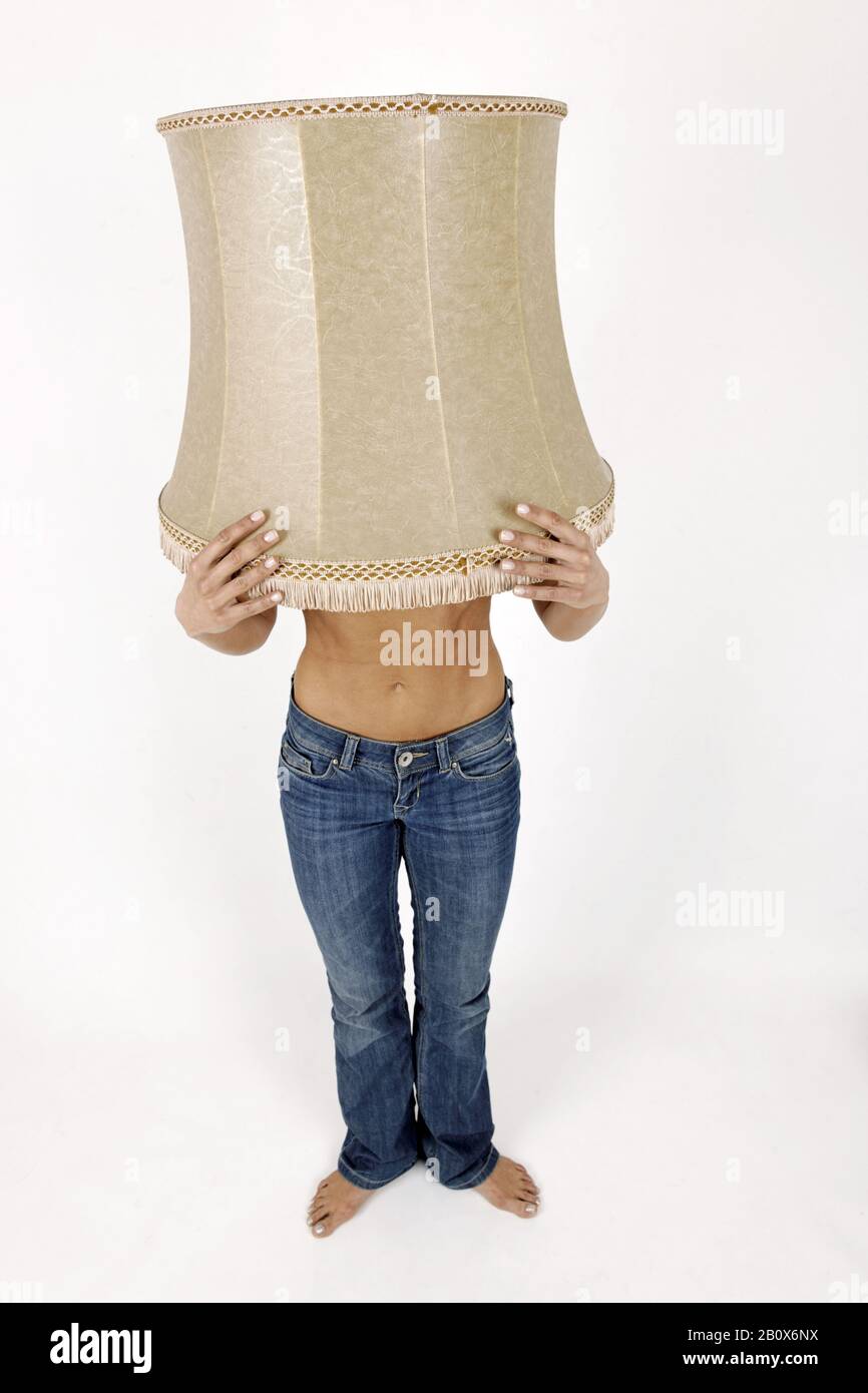 Woman hiding under lampshade hi-res stock photography and images - Alamy
