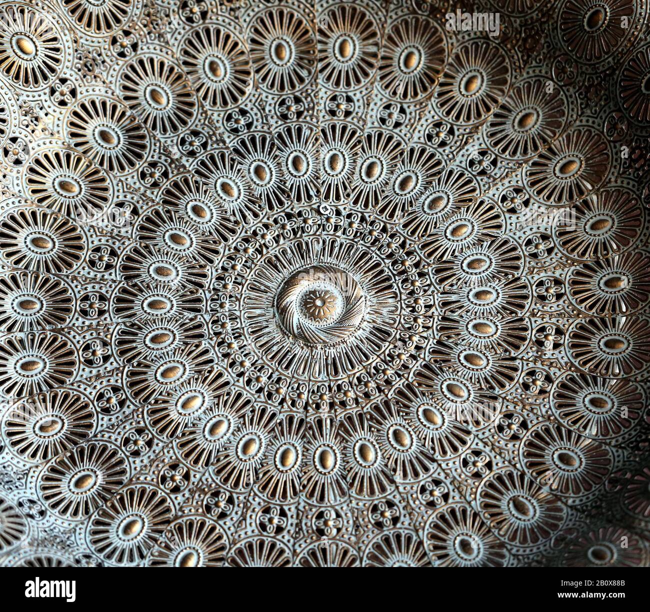 Photo of a beautiful metal dish ornament Stock Photo - Alamy