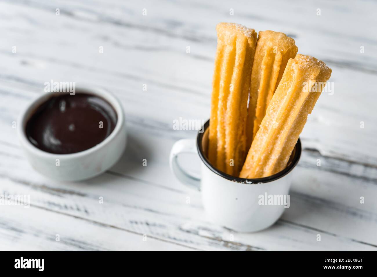 Churros with chocolate, a traditional Spanish sweet food pastry dessert ...