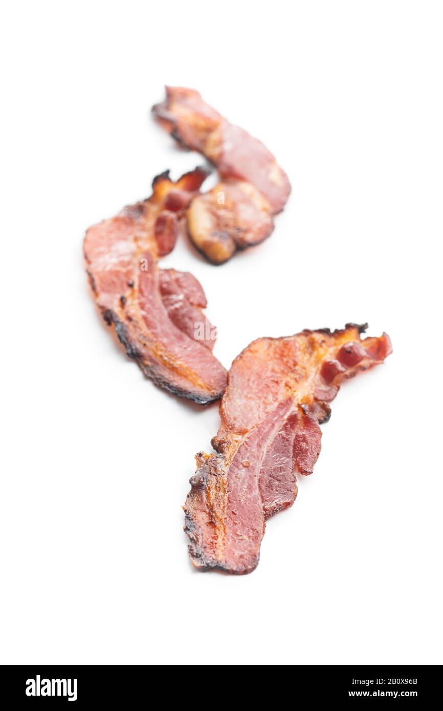 Fried bacon. Sliced roasted bacon isolated on white background Stock ...
