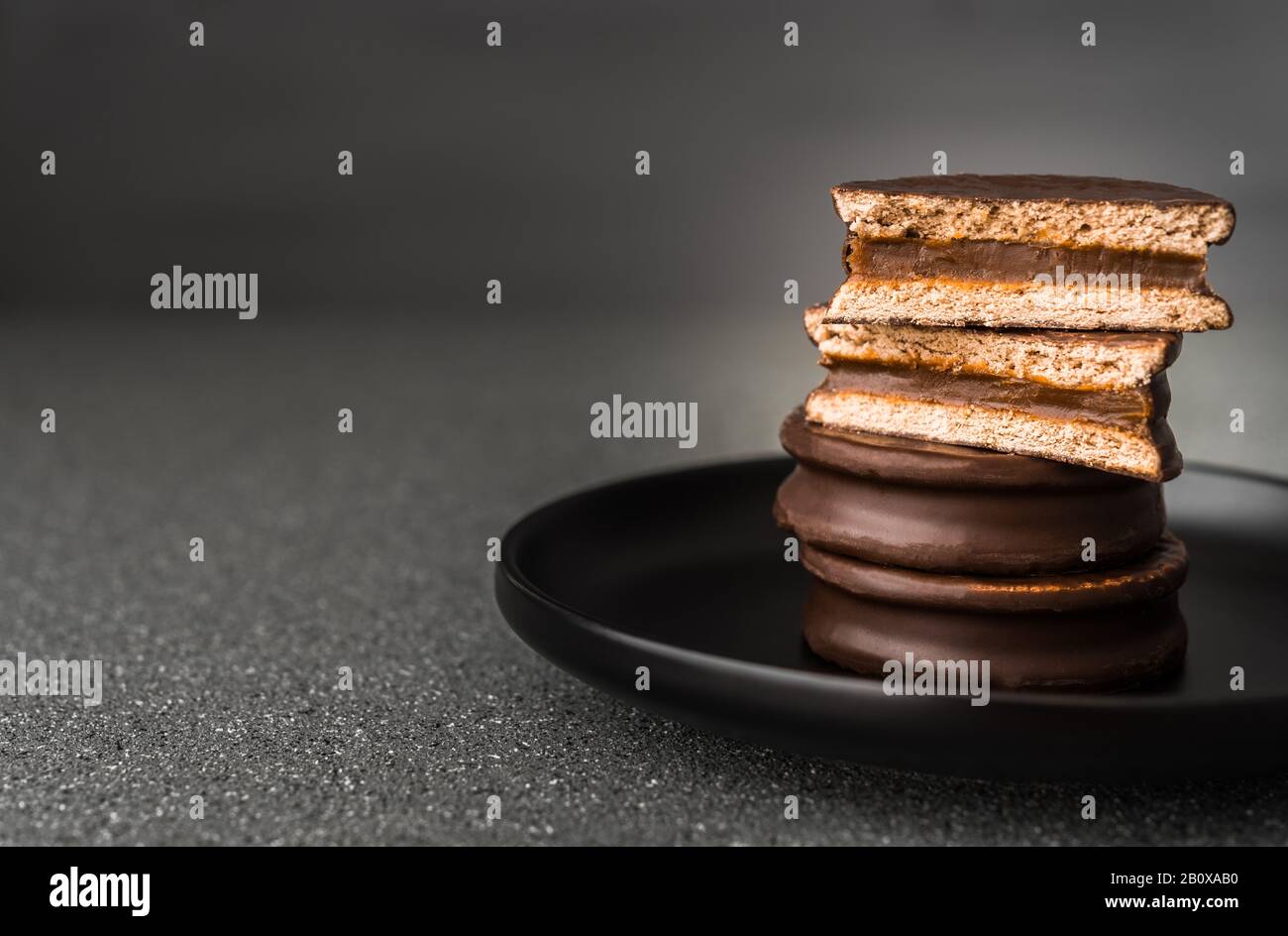 Alfajor with dulce de leche cake, Argentine dessert with chocolate and ...