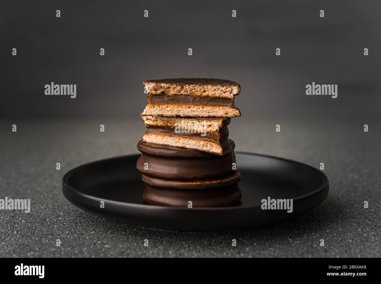 Alfajor with dulce de leche cake, Argentine dessert with chocolate and ...