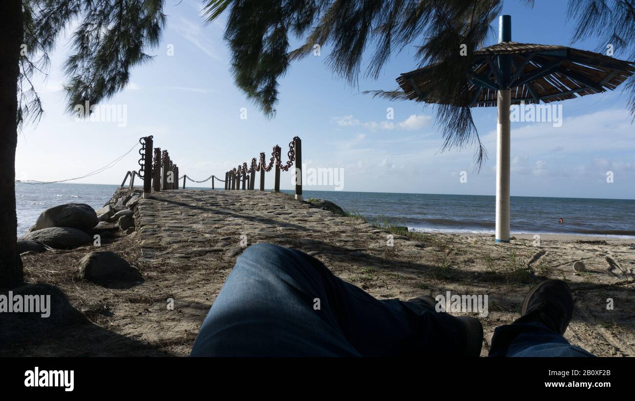 Relaxing on the beach with the view and sun Stock Photo - Alamy