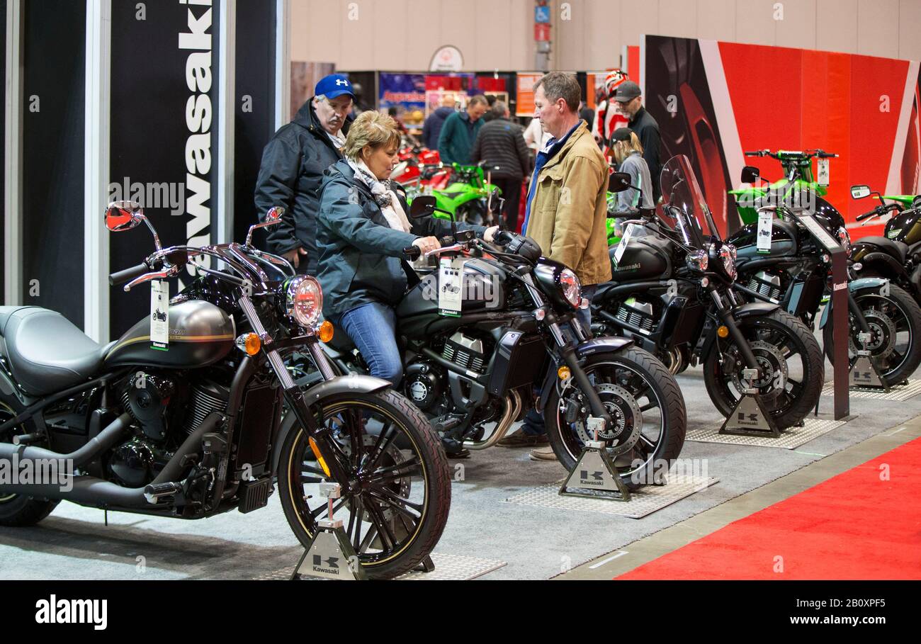 Toronto, Canada. 21st Feb, 2020. A woman rides on a Kawasaki motorcycle ...