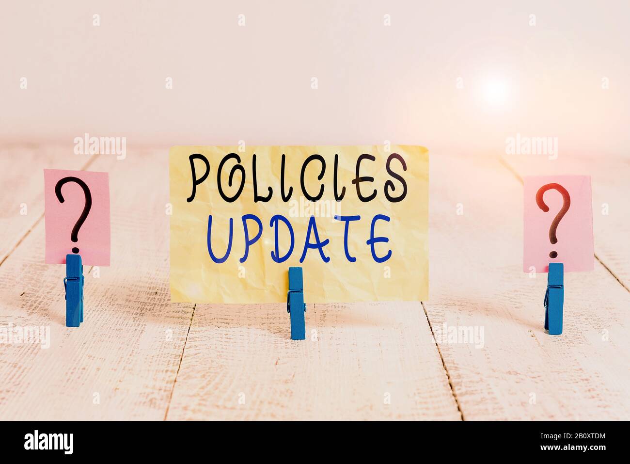 Writing note showing Policies Update. Business concept for act of adding new information or ...