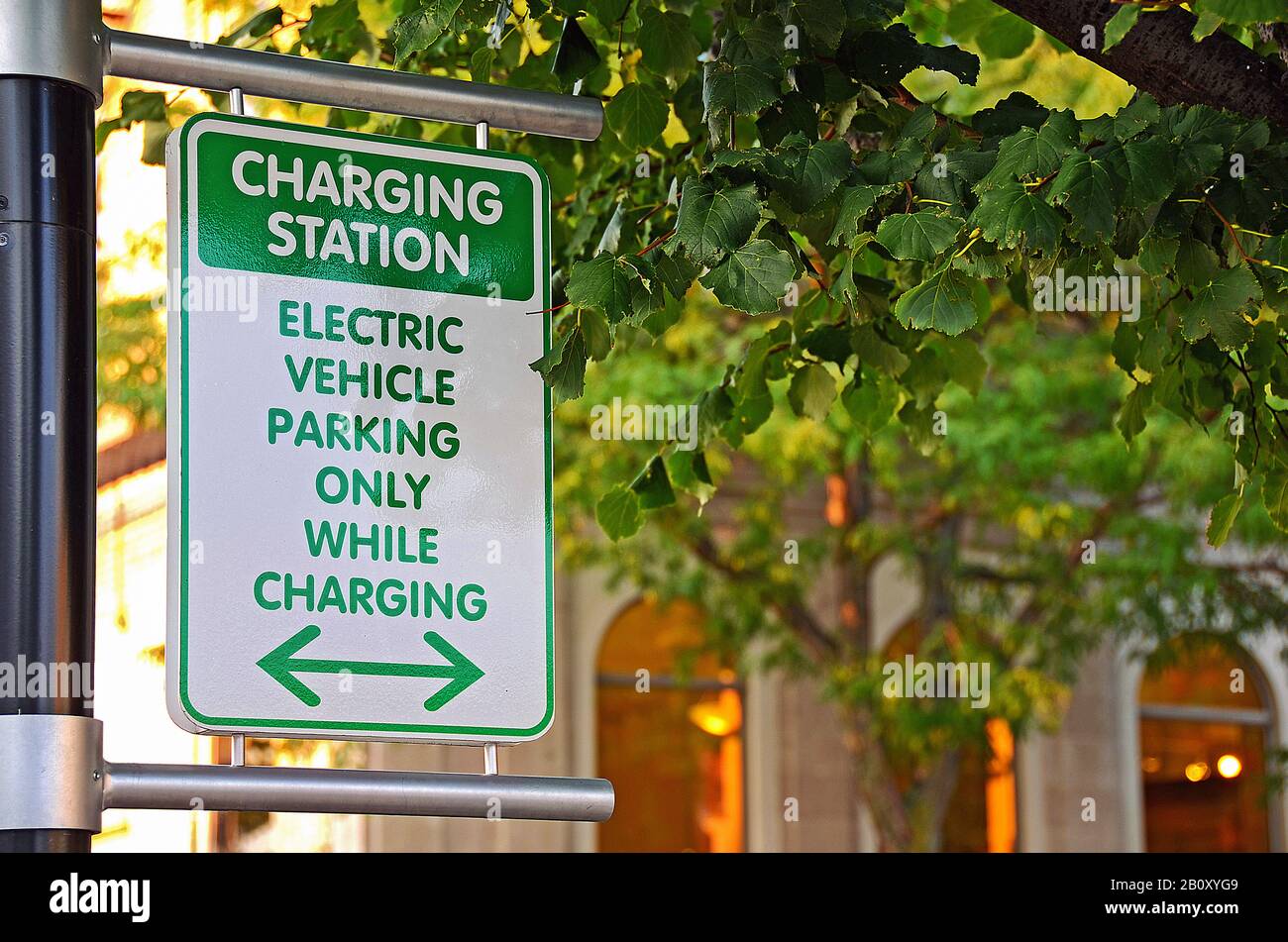 electric car charging station sign on post Stock Photo - Alamy