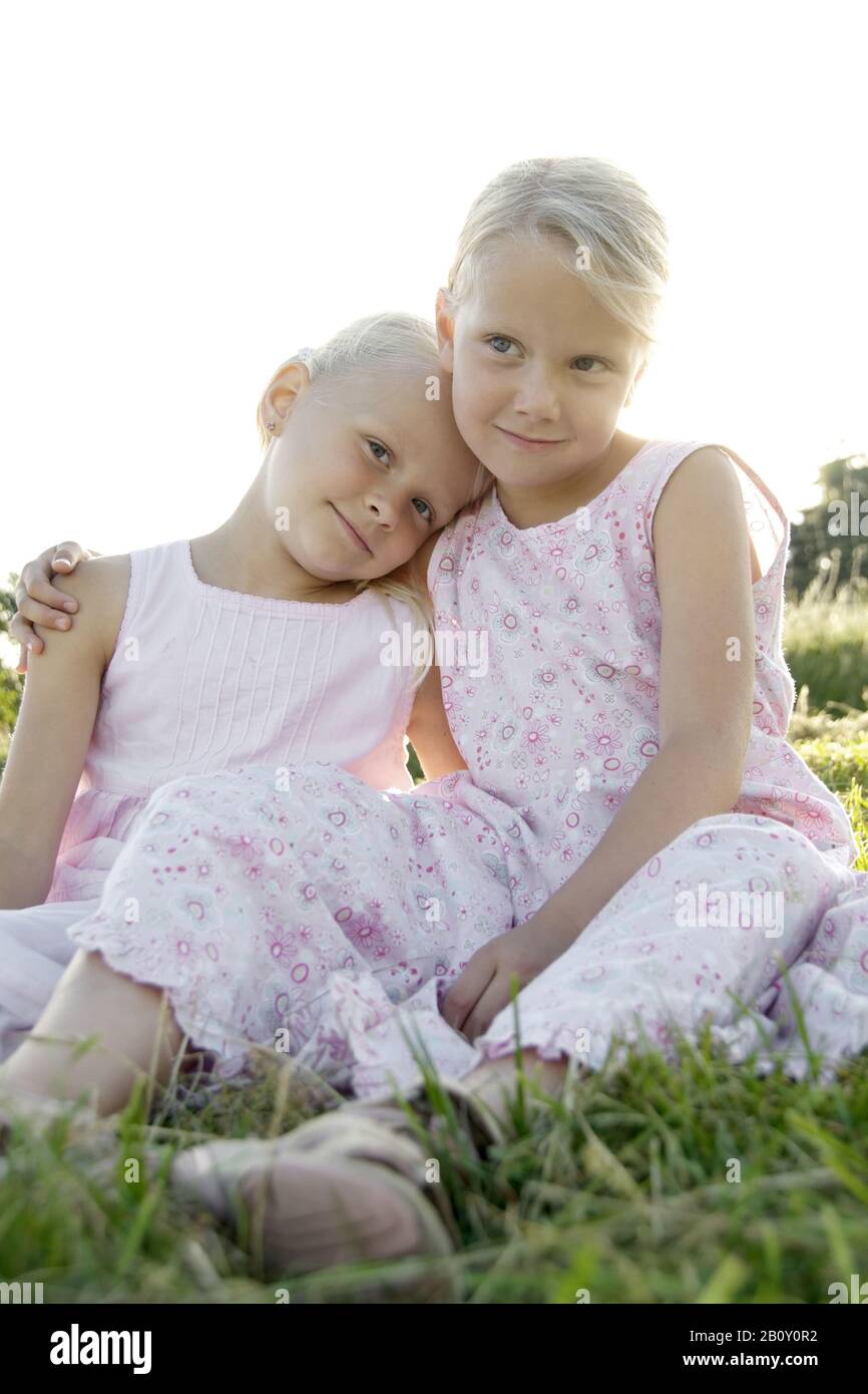 Two girls arm in arm hi-res stock photography and images - Alamy