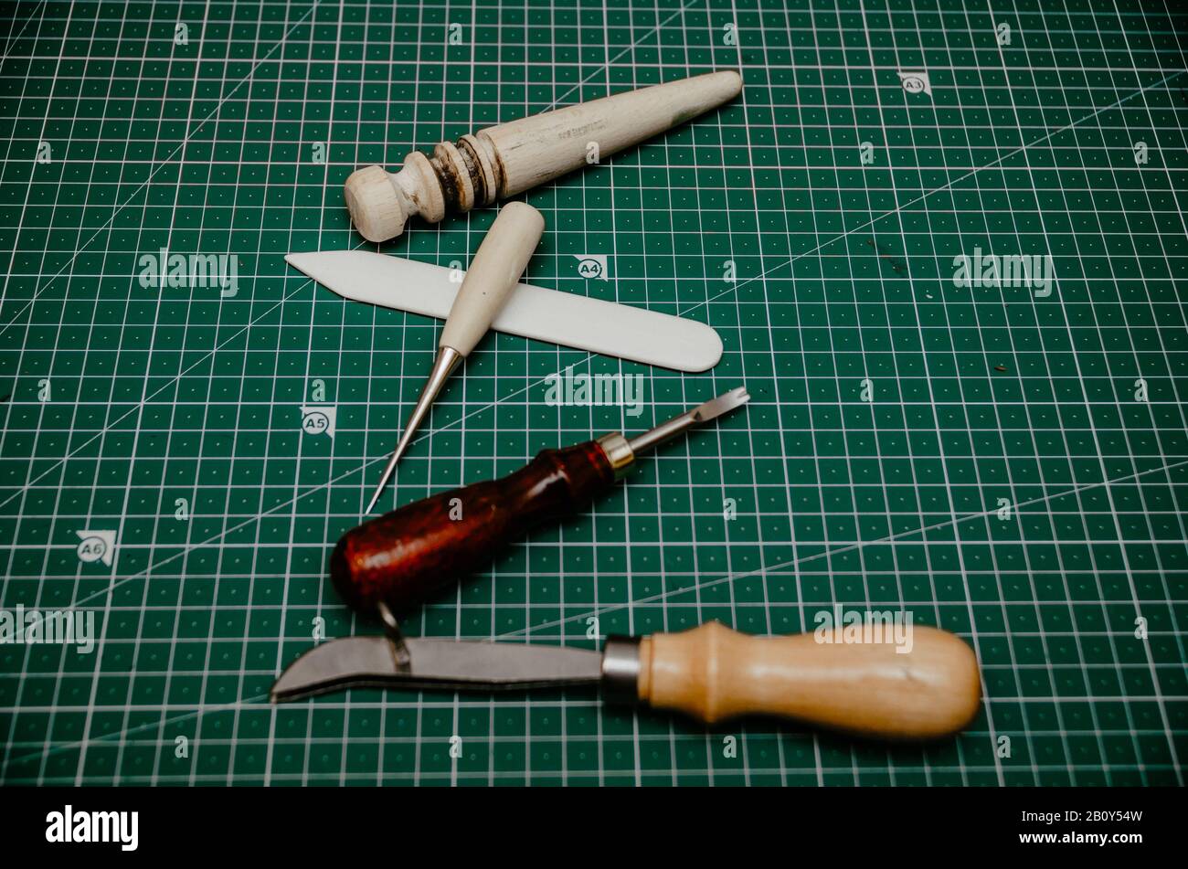 Leather crafting tools still life. handmade. leather tools Stock Photo ...