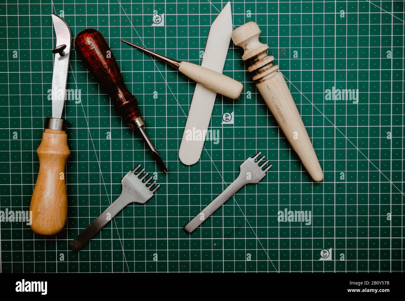 Leather crafting tools still life. handmade. leather tools Stock Photo ...