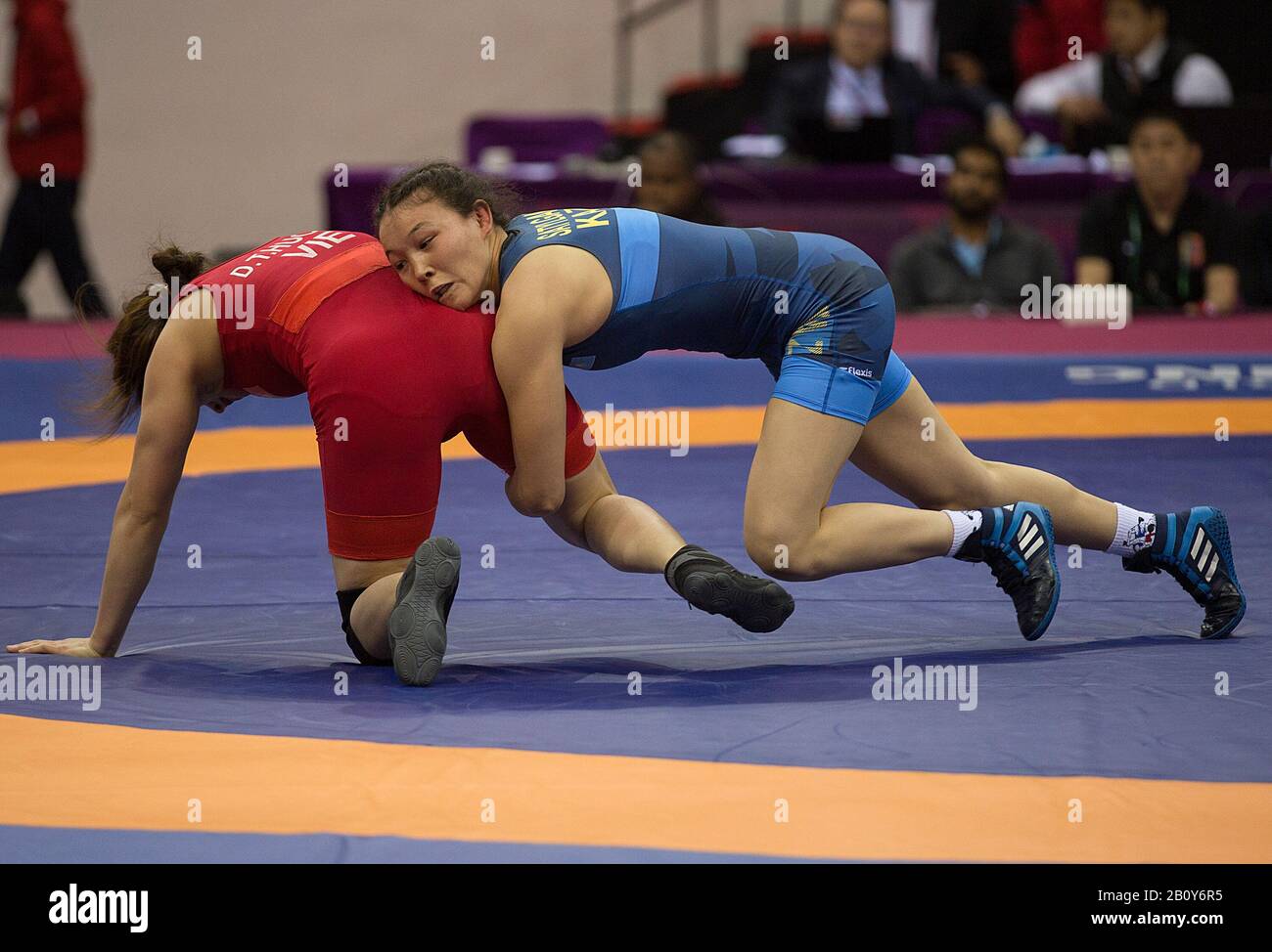 New Delhi. 21st Feb, 2020. Altynay Satylgan (R) of Kazakhstan vies with ...