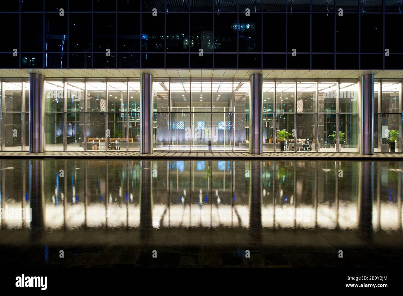 Illuminated office windows in Dubai International Financial Center ...