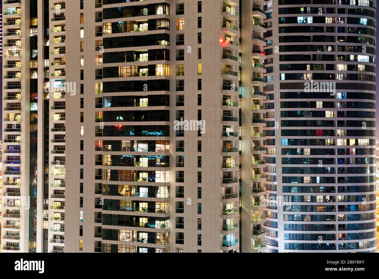 Illuminated facades of high-rise buildings in Jumeirah Lakes Towers ...