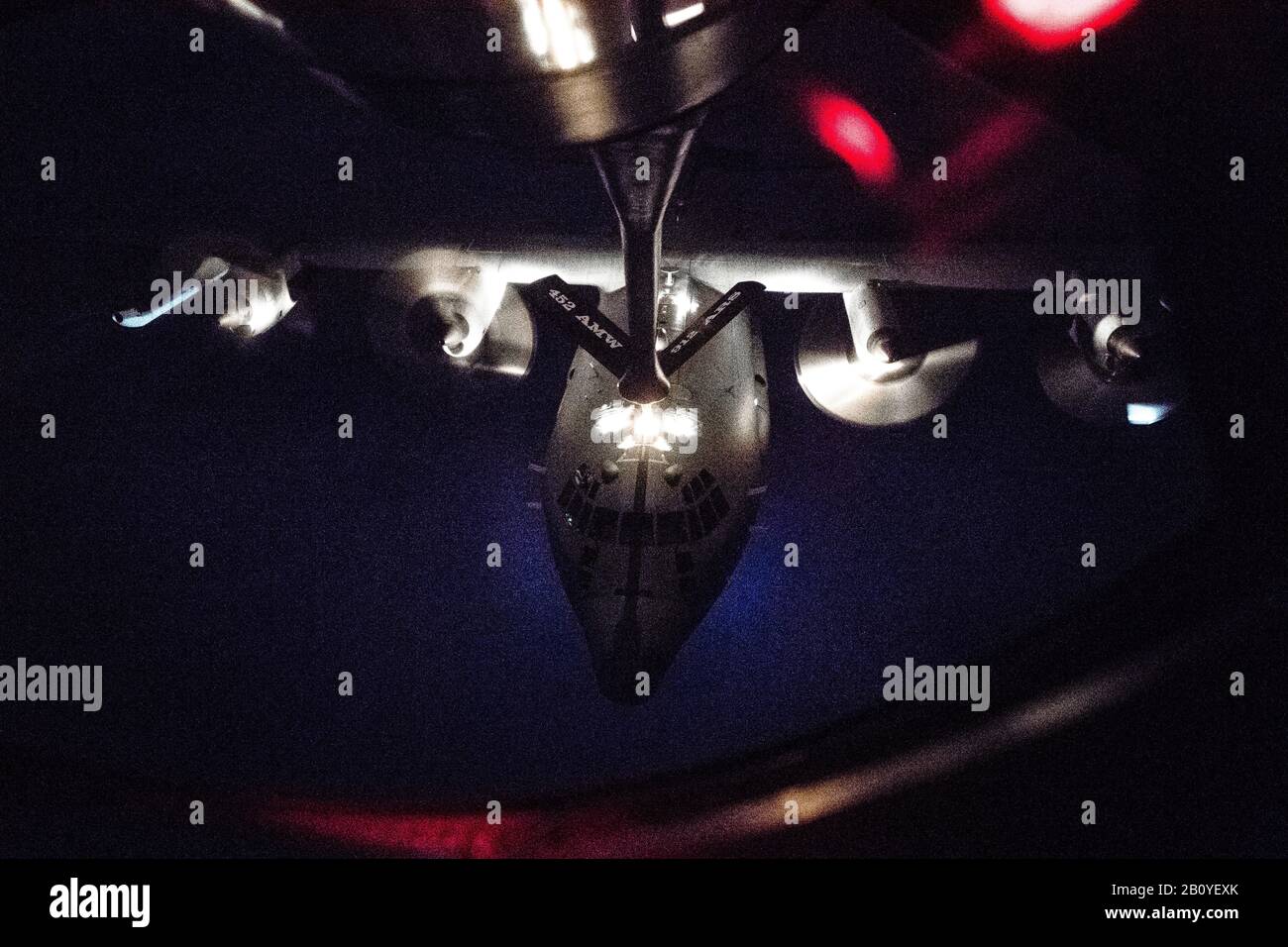 A 55th Electronic Combat Group EC-130H Compass Call receives fuel from ...