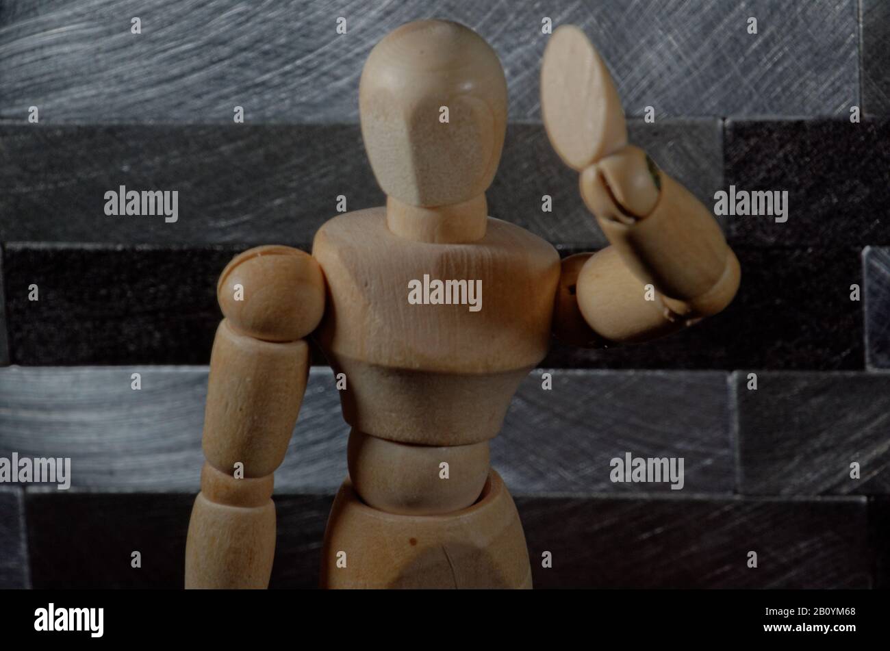 Wooden mannequin waving hand Stock Photo - Alamy
