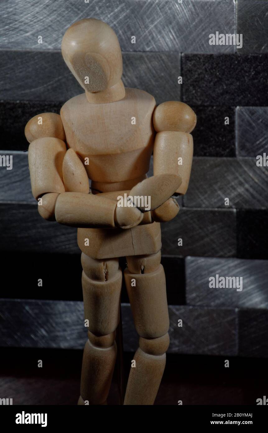 Wooden mannequin with crossed arms - vertical shot Stock Photo - Alamy