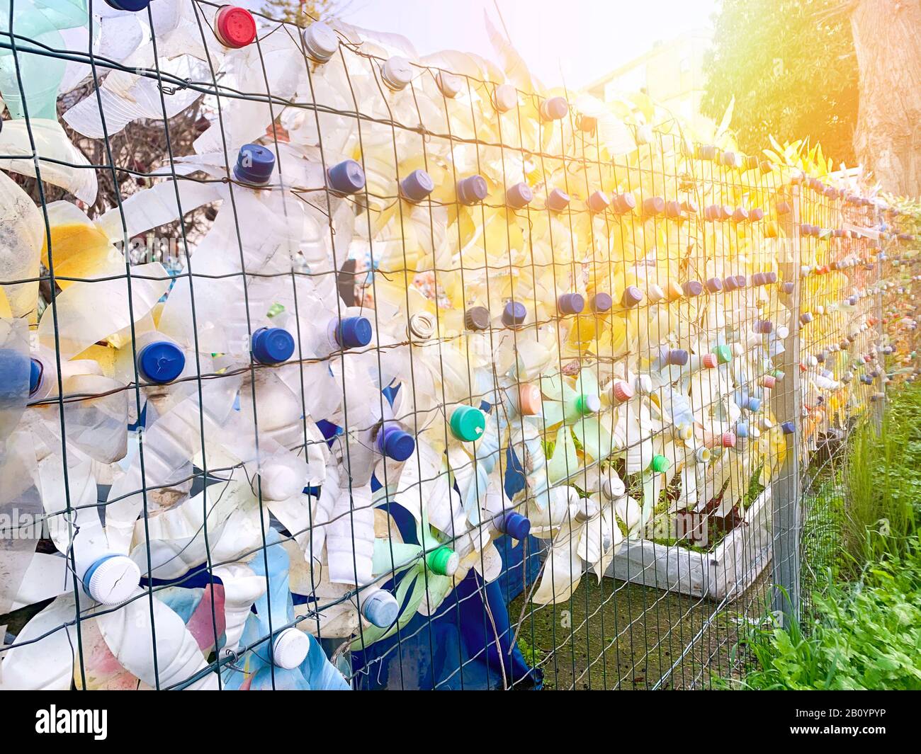 DIY fence from garbage various plastic bottles. Idea for reuse and ...
