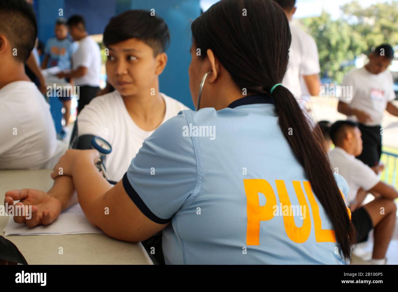 Quezon, Philippines. 20th Feb, 2020. Police nurse conduct blood ...