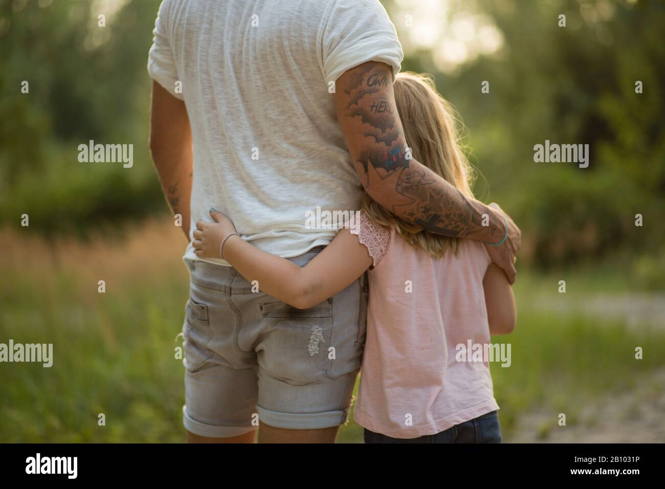 Father and daughter together in the forest Stock Photo - Alamy