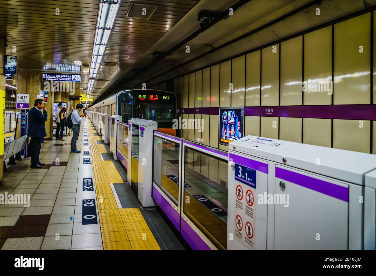 Passengers waiting for their train at subway underground station ...