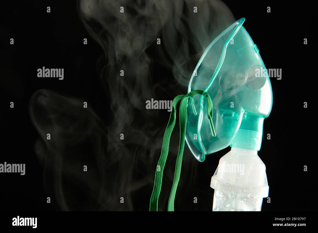 Green plastic inhaler mask close up isolated on black background Stock ...