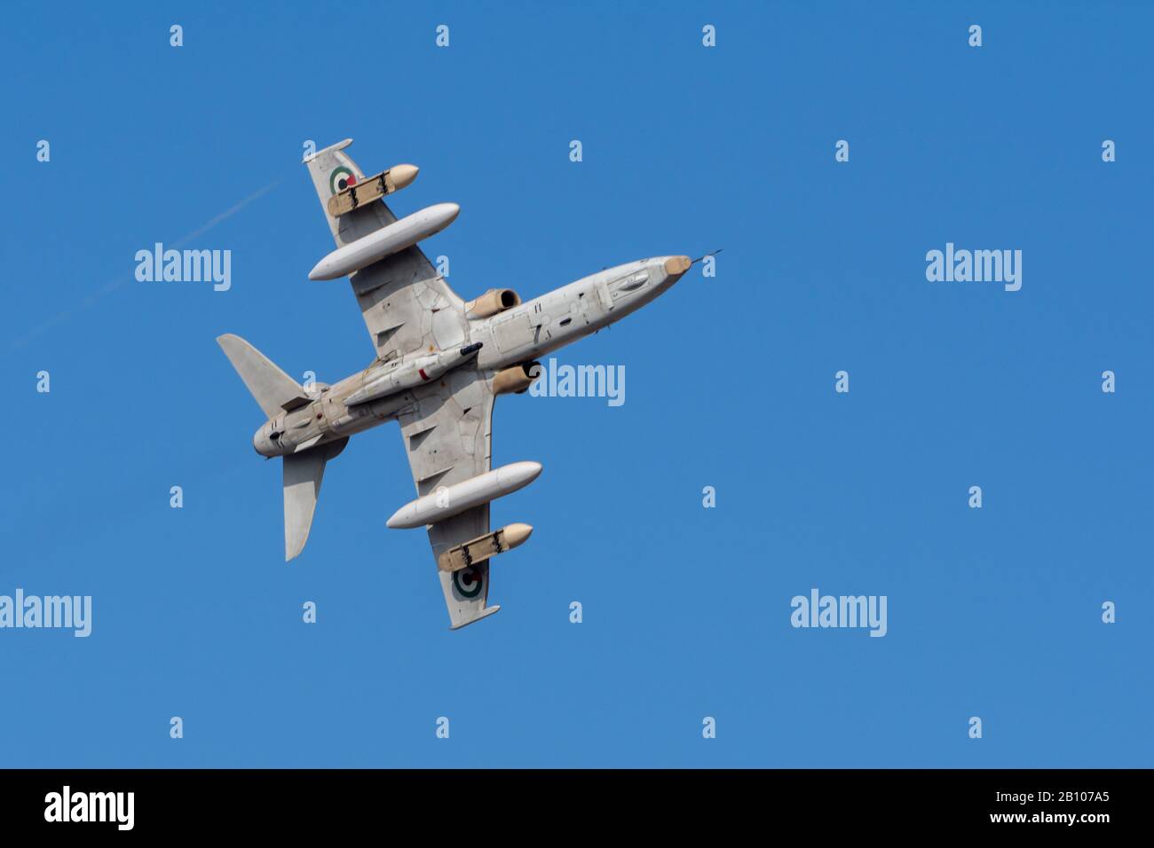 Military fighter jet flying fast through the air in coordination with ...