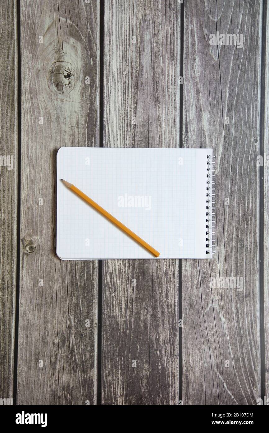 Notepad with a blank white sheet in a checker paper with simple ...