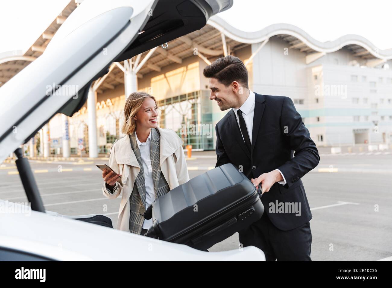 Image Of Young Caucasian Businesslike Man And Woman In Formal Wear