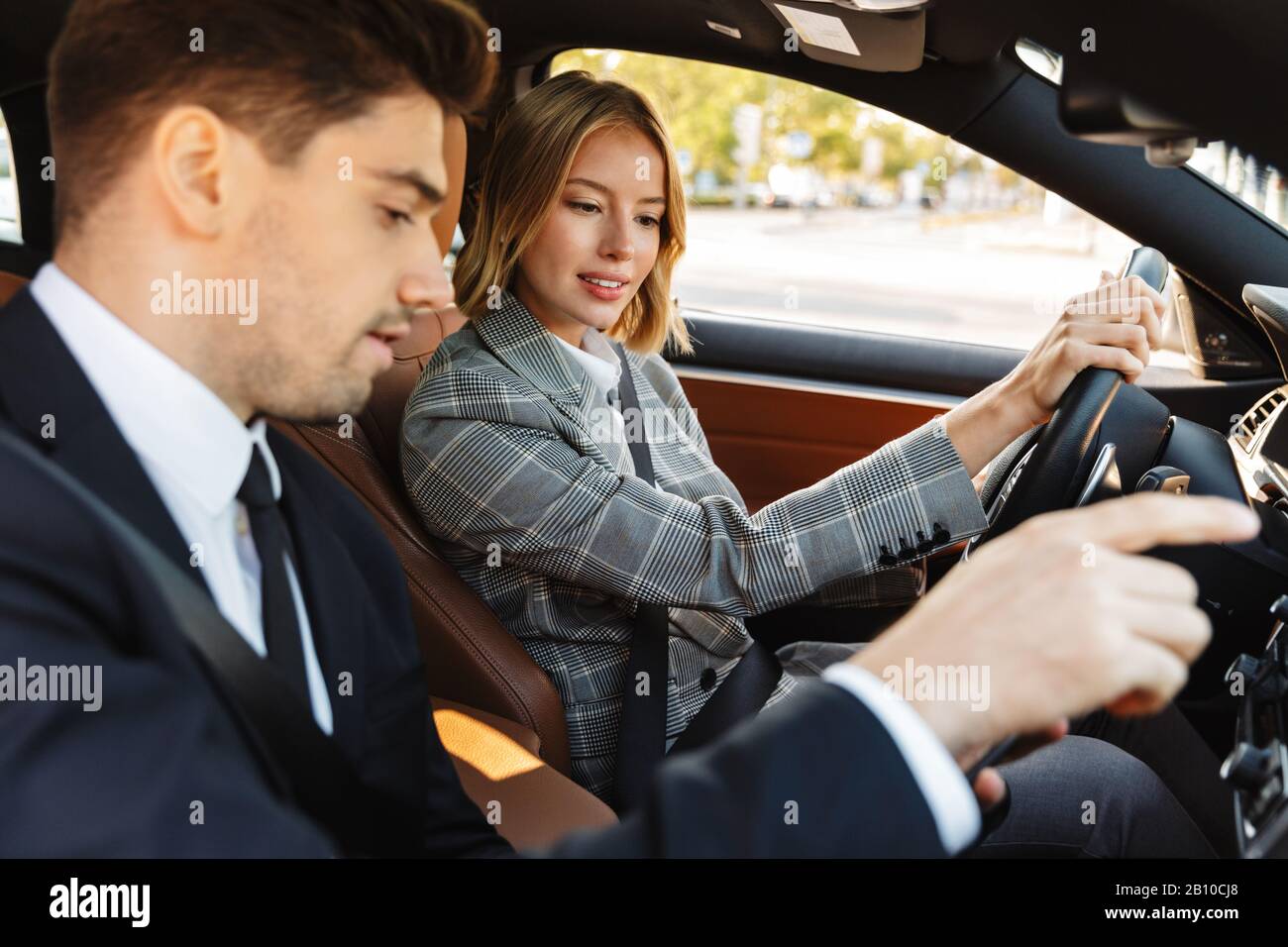 Image Of Young Caucasian Successful Businesslike Man And Woman In
