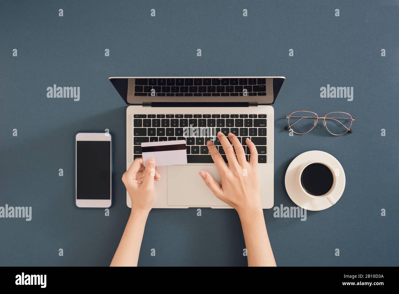 Internet banking. Closeup hand of girl typing credit card details on ...
