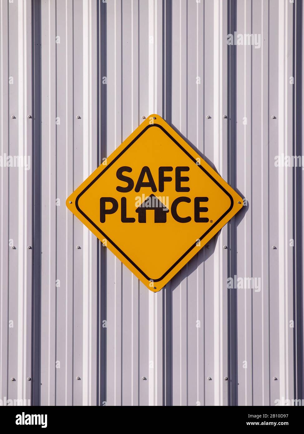 Safe place sign of a light metal wall of a building Stock Photo - Alamy