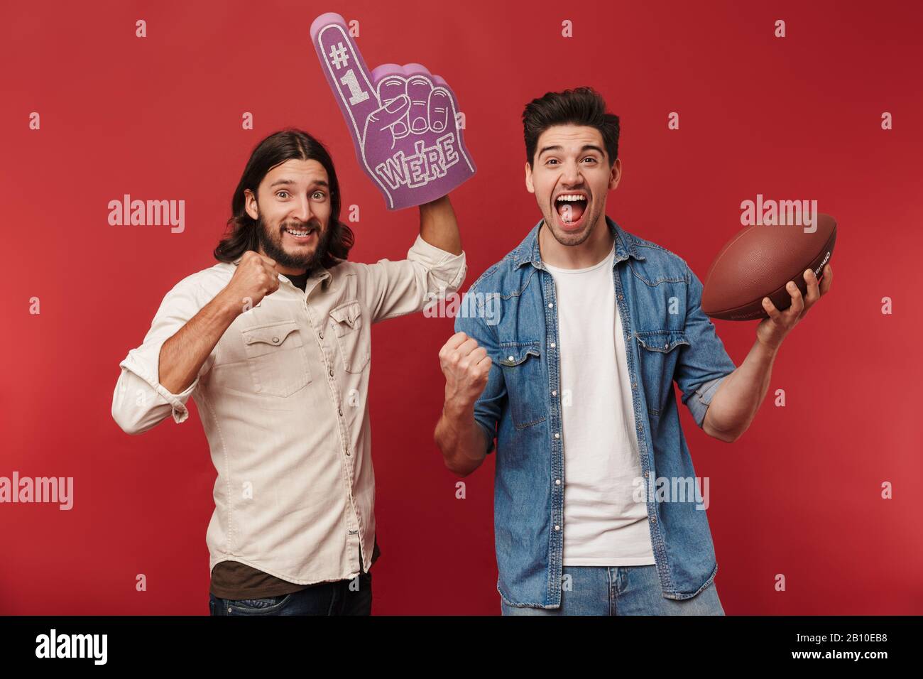 Two emotional football fans screaming hi-res stock photography and ...
