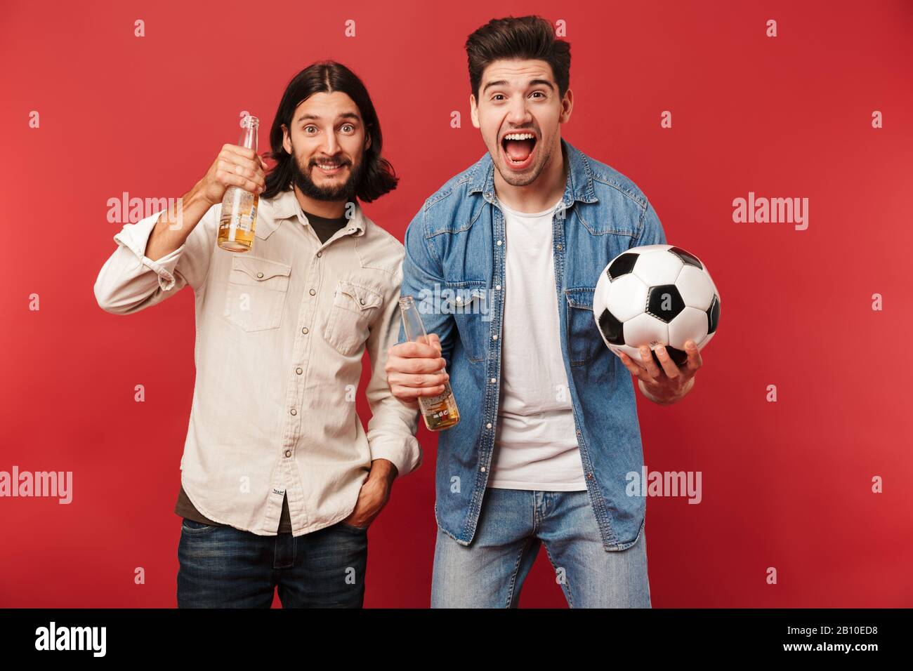 Photo of excited guys fans holding beers and soccer ball while watching ...