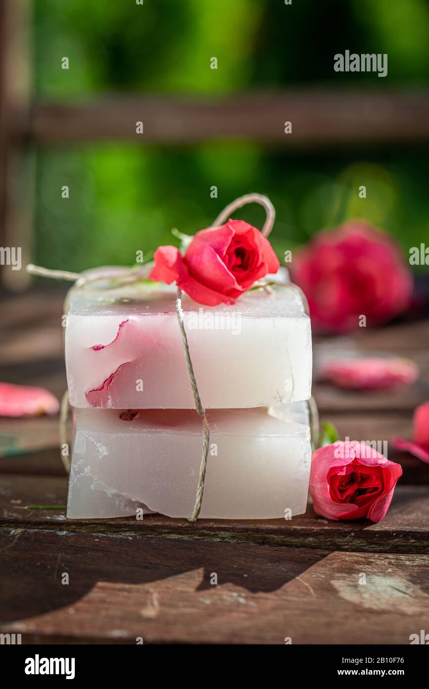 Cubes of handmade rose soap wrapped in a string Stock Photo - Alamy